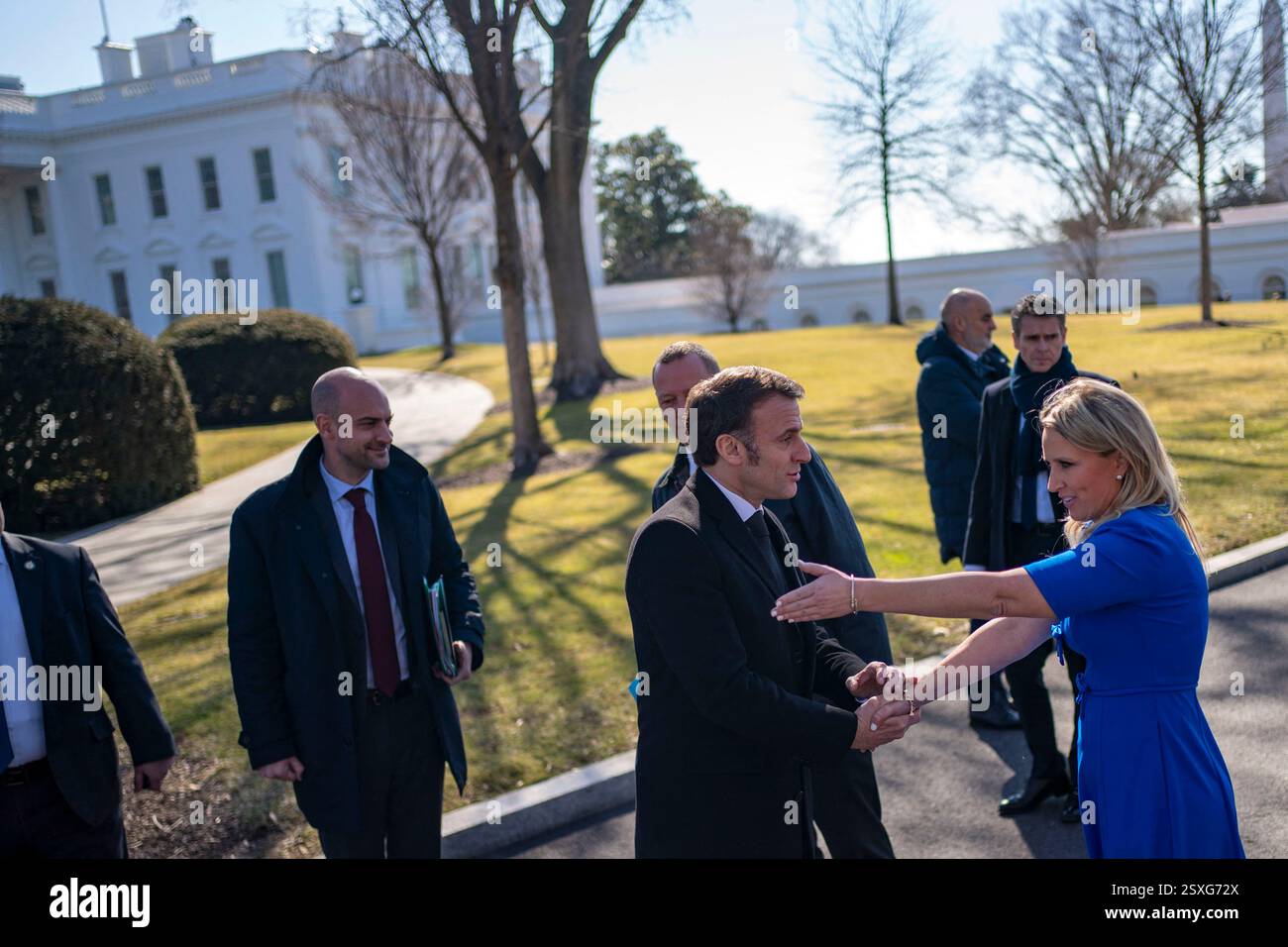 President of France Emmanuel Macron and White House Chief of Protocol Monica Crowley depart the ...
