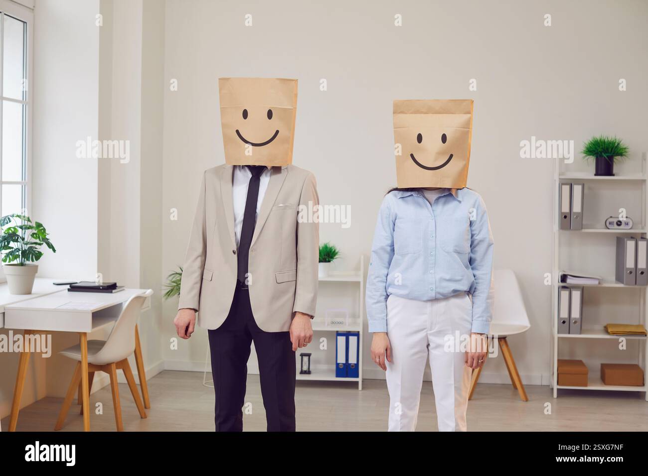 Happy employees office managers workers standing wearing paper bag with ...
