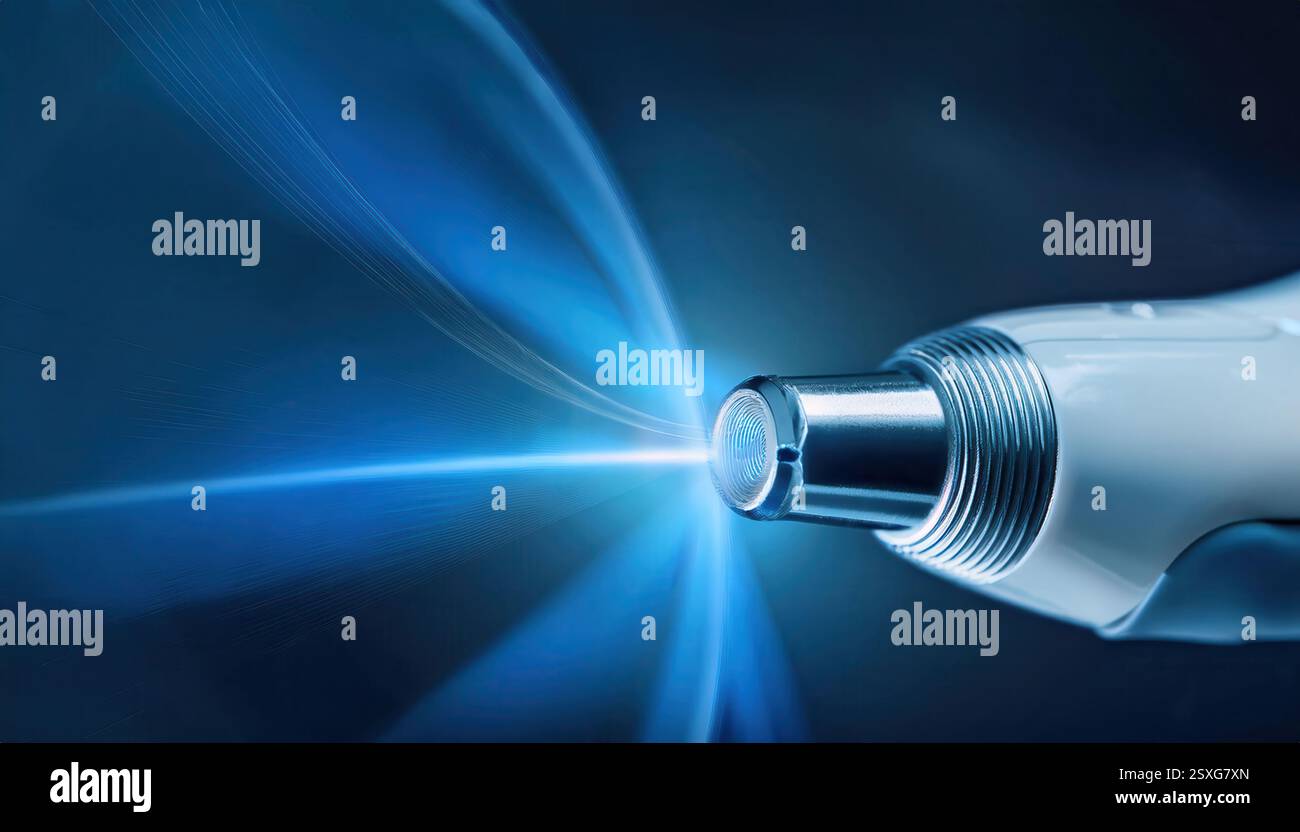 A high tech dental tool projects a blue light in a modern clinic ...