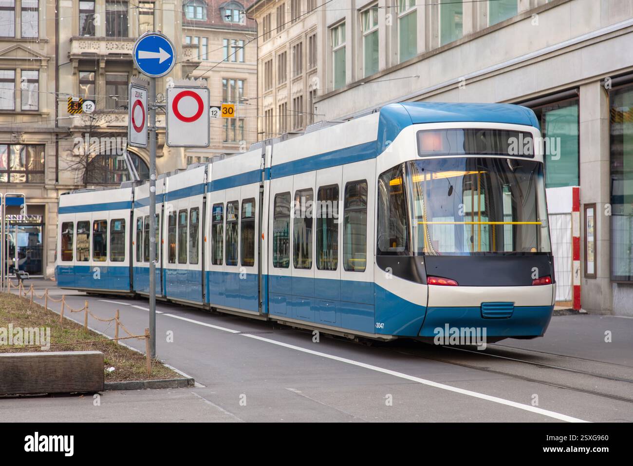 Blue tram in Zurich city center. Modern new vehicle closeup, public ...