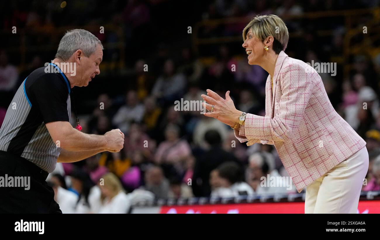Iowa head coach Jan Jensen questions a call against her team during the ...