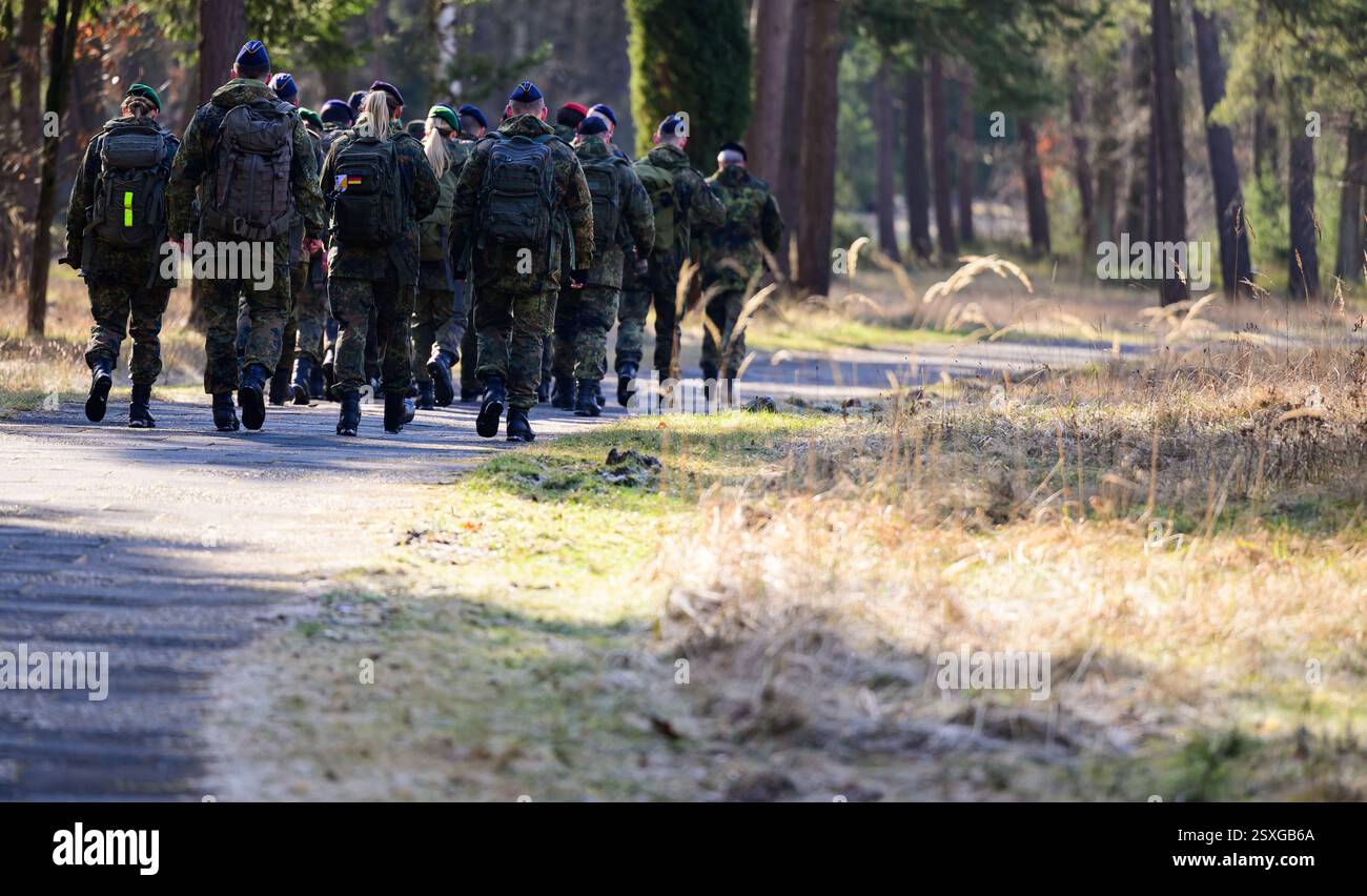 Bergen, Germany. 17th Feb, 2025. Soldiers walk across the grounds of ...
