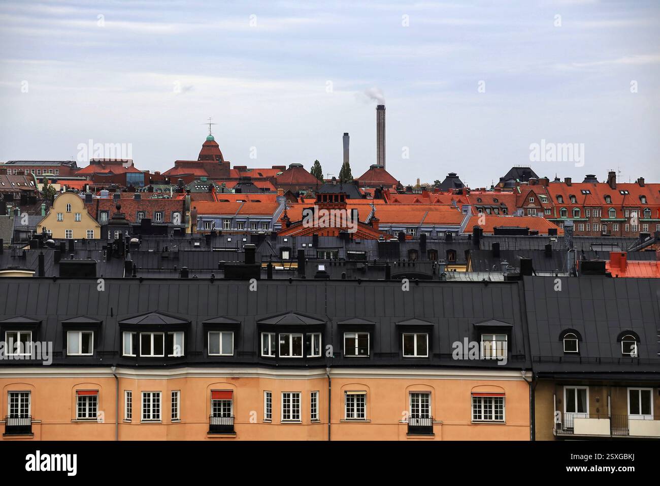 Rooftop cityscape with chimneys in stockholm, showcasing red-tiled ...
