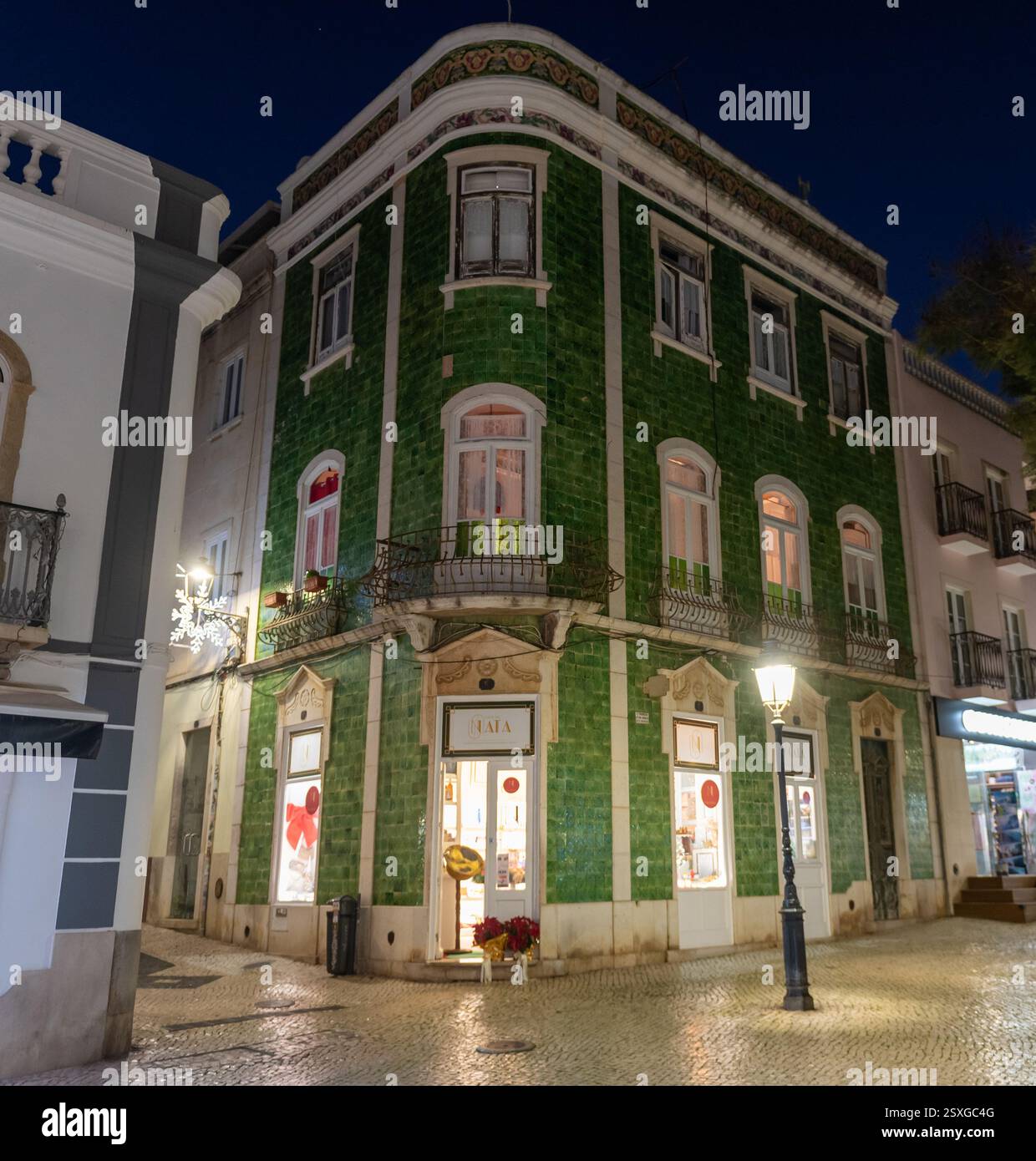 Lagos, Portugal with traditional green tiled building and mosaic ...