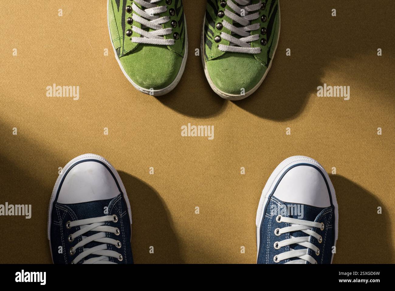 Young couple meeting and standing one in front of each other, feet top ...