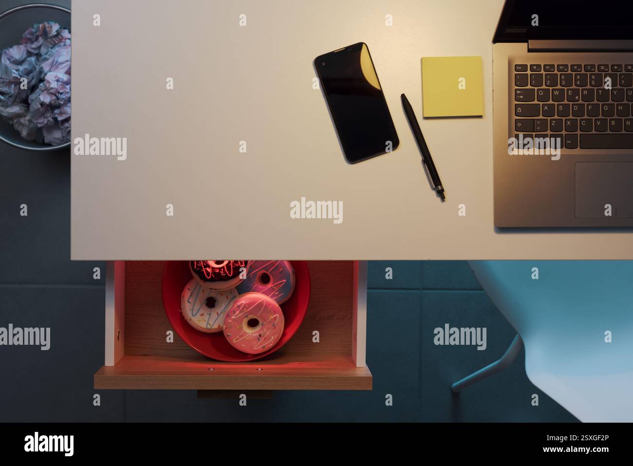 Delicious donuts hidden in the work desk drawer, diet and unhealthy ...