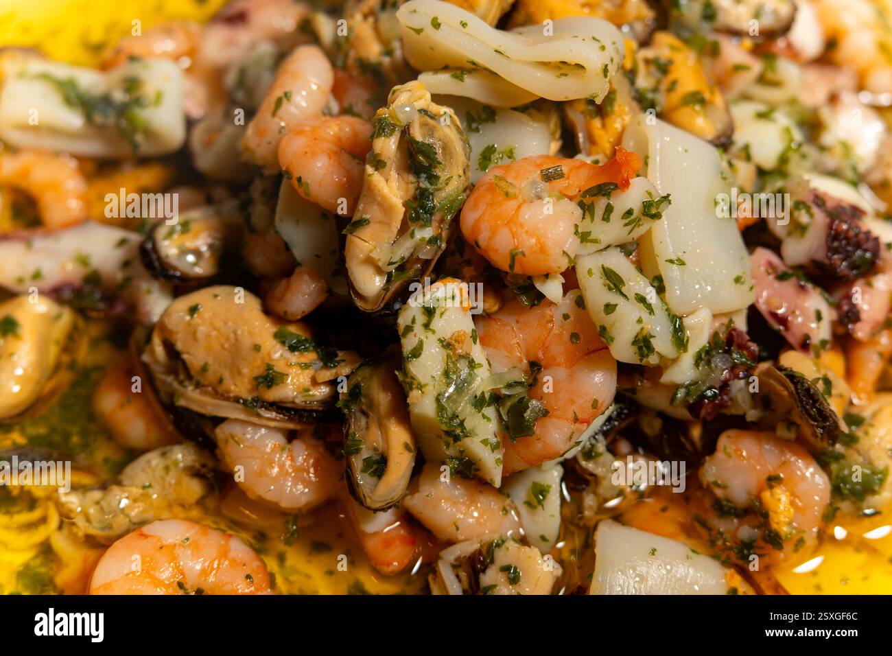 A delicious seafood dish featuring shrimp, scallops, and mussels is ...