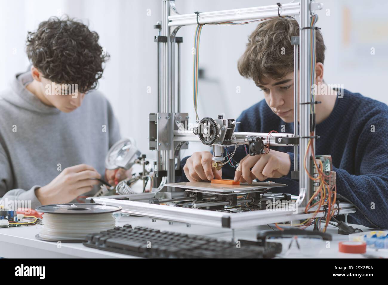 Young students working together in the lab, they are learning how to ...