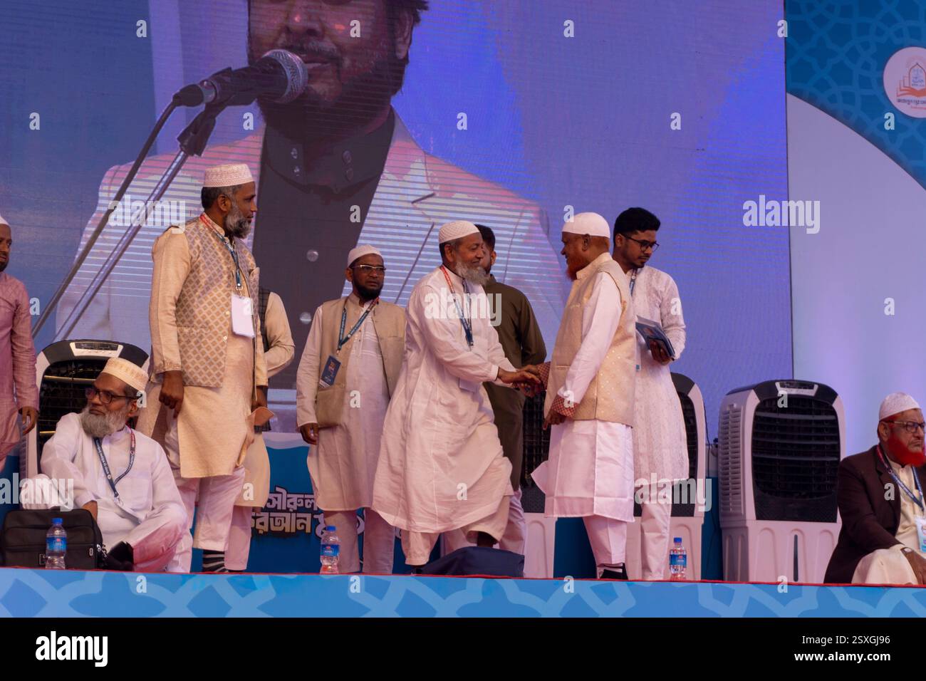 Jamaat-e-Islami leader Narul Islam Bulbul waves greetings to the crowd ...