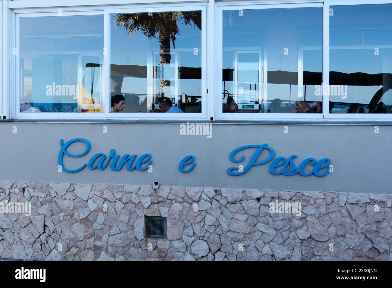 Catania. Italy - February 24, 2025: Vibrant Sicilian seaside restaurant ...