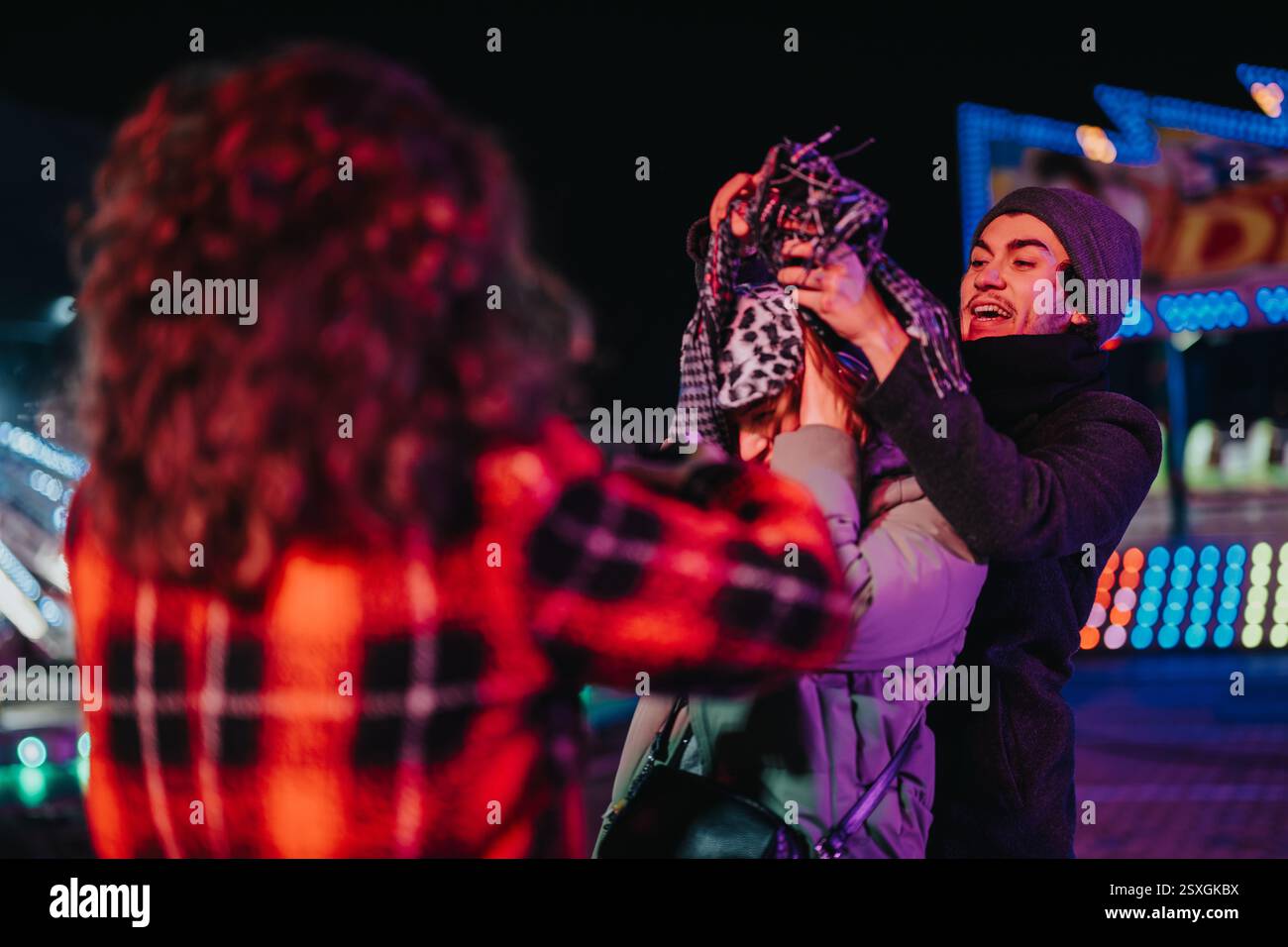 Friends having fun at night in a festive outdoor environment Stock ...