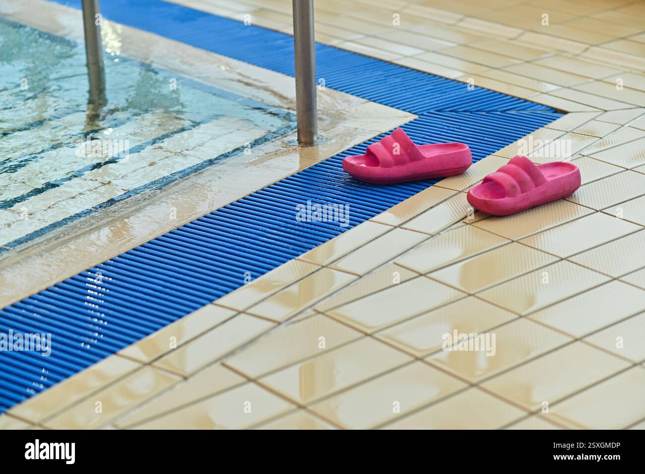 flip-flops left in front of the pool Stock Photo - Alamy