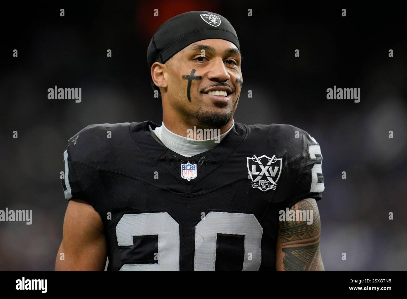 FILE - Las Vegas Raiders safety Isaiah Pola-Mao (20) stands on the field before an NFL football ...