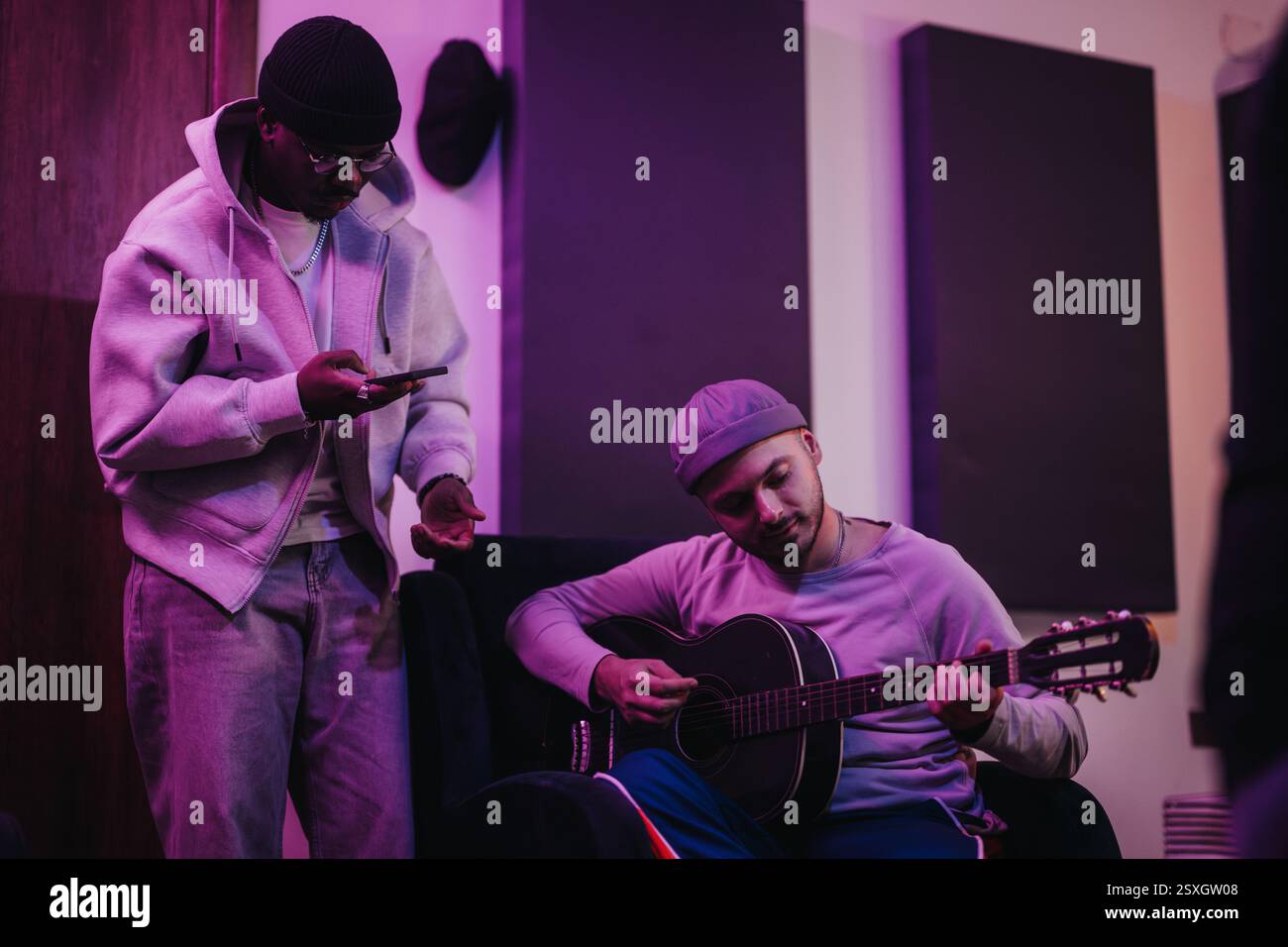 Talented multiracial musicians collaborate creatively in modern music ...