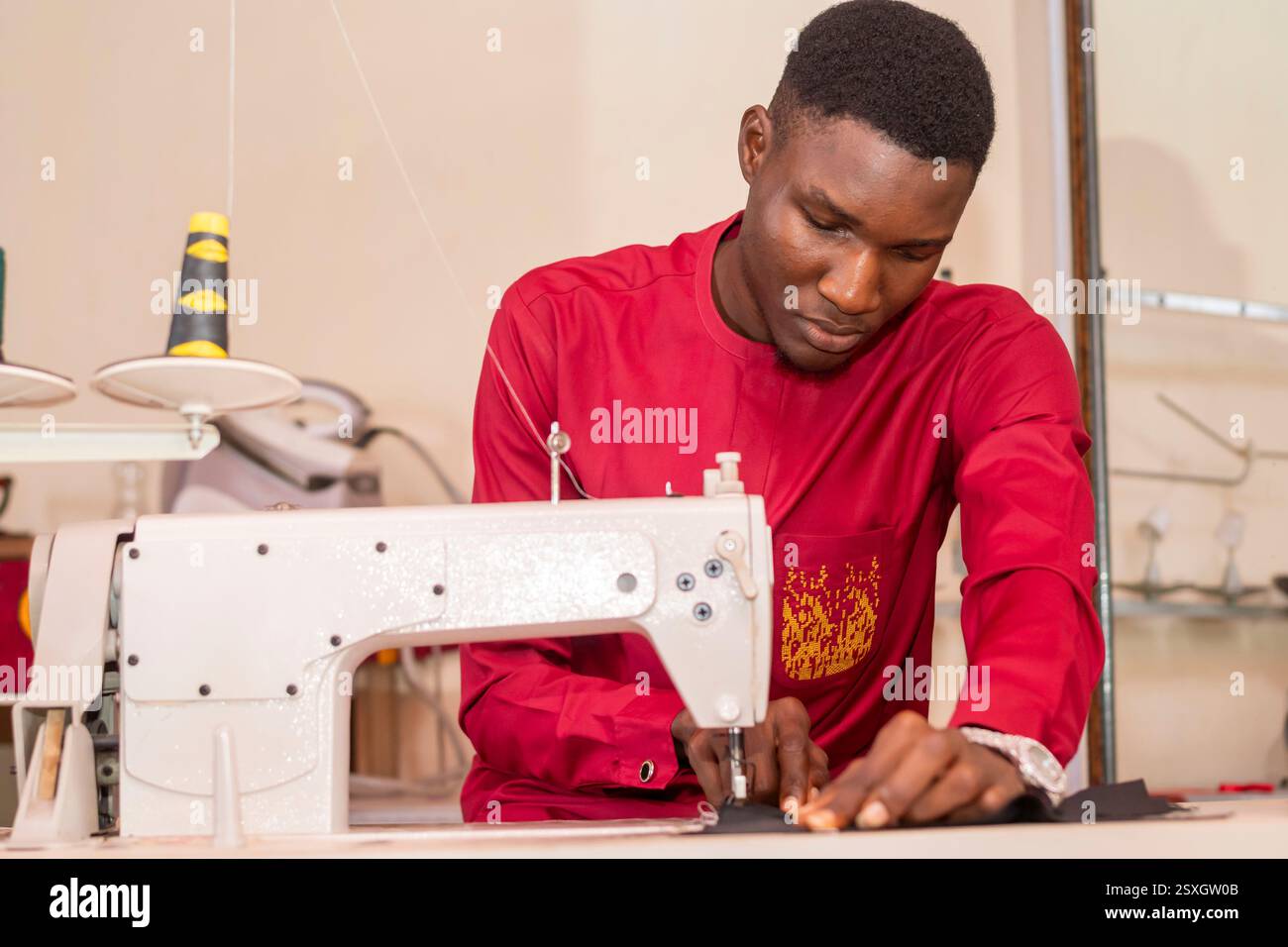 African dressmaker working sewing machine hi-res stock photography and ...