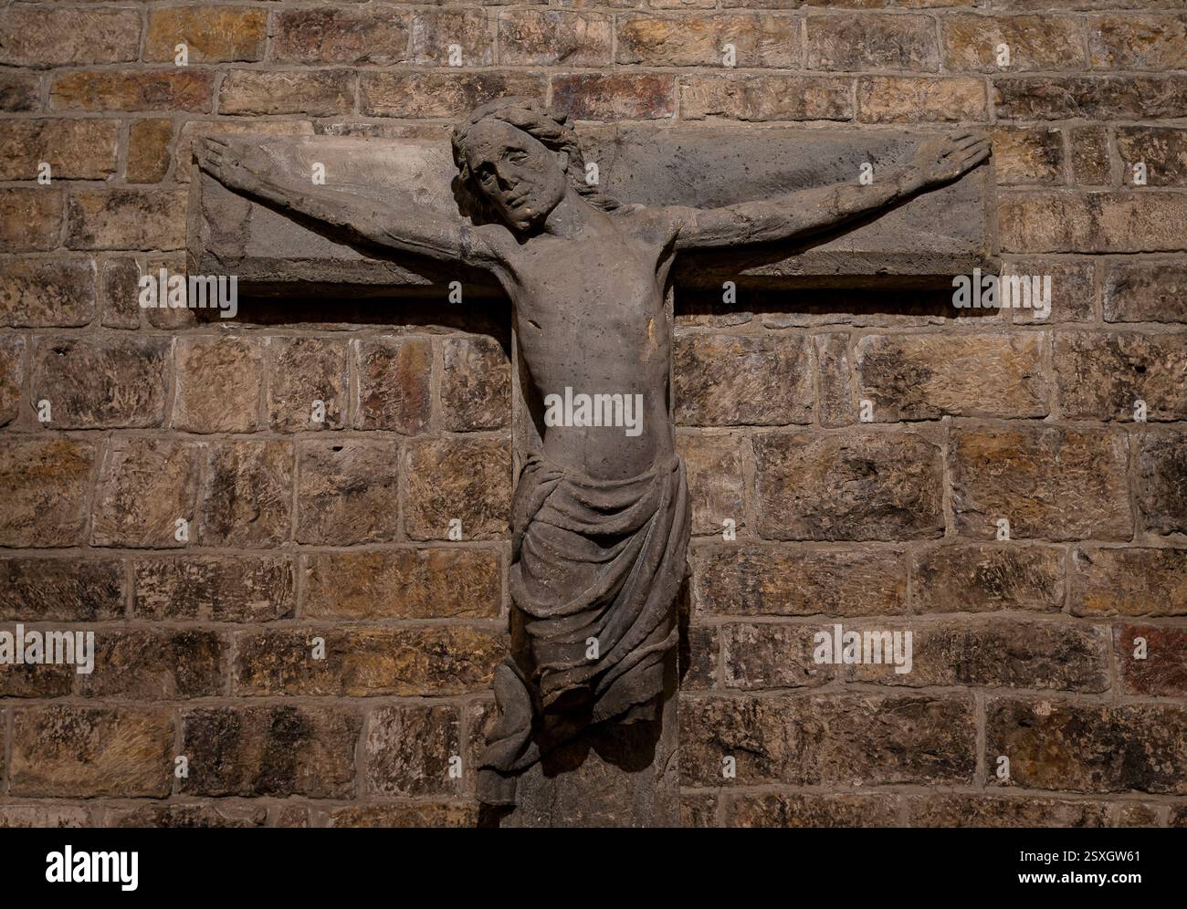 Jesus Christ crucifix sculpture on stone wall in the St. Peter's ...