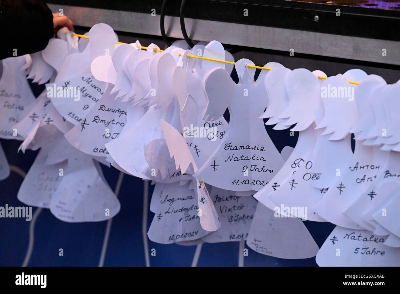 Cologne, Germany. 24th Feb, 2025. White angels with the names of ...