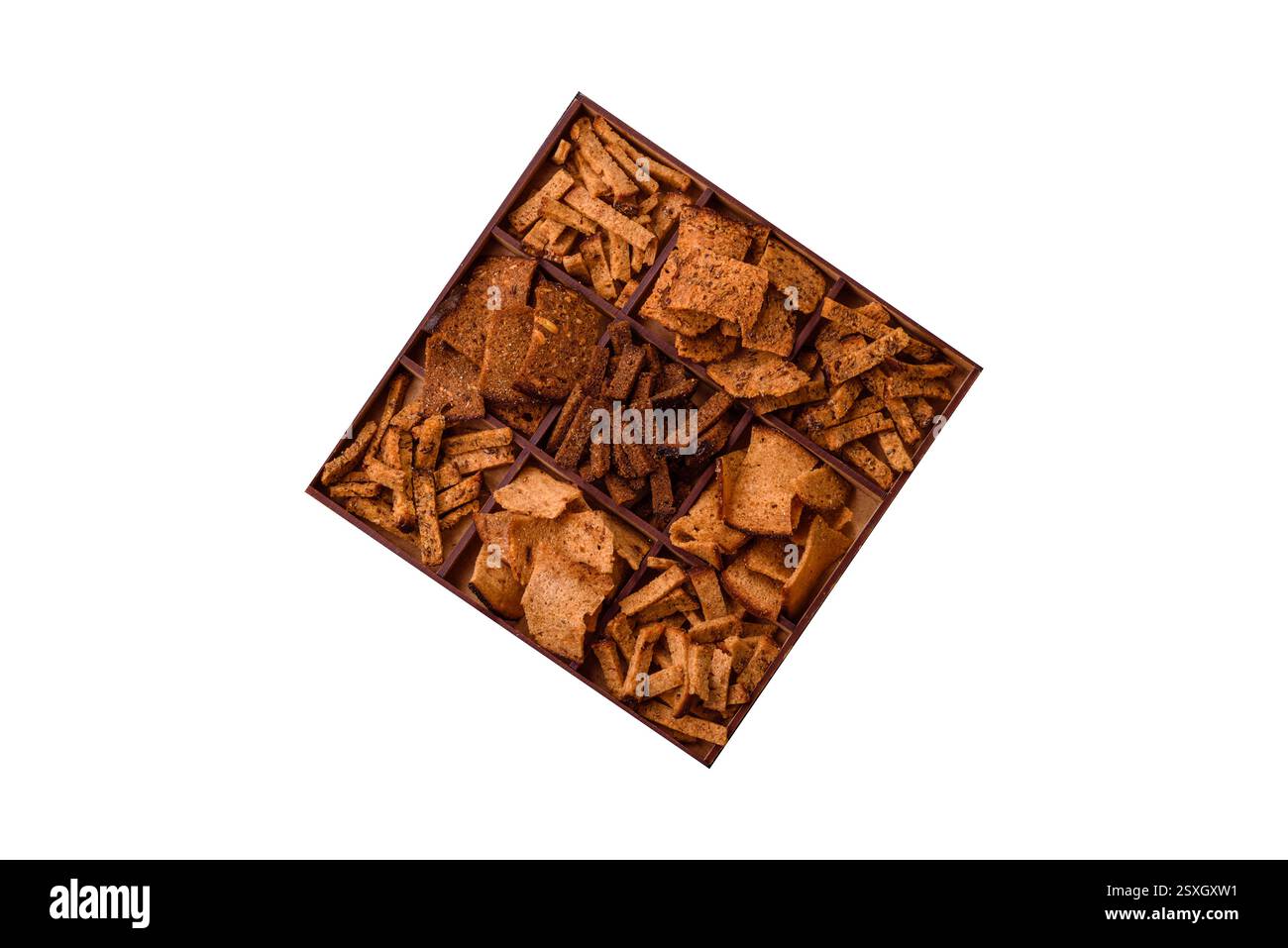 Crispy homemade brown bread chips with seeds and grains, salt, spices ...