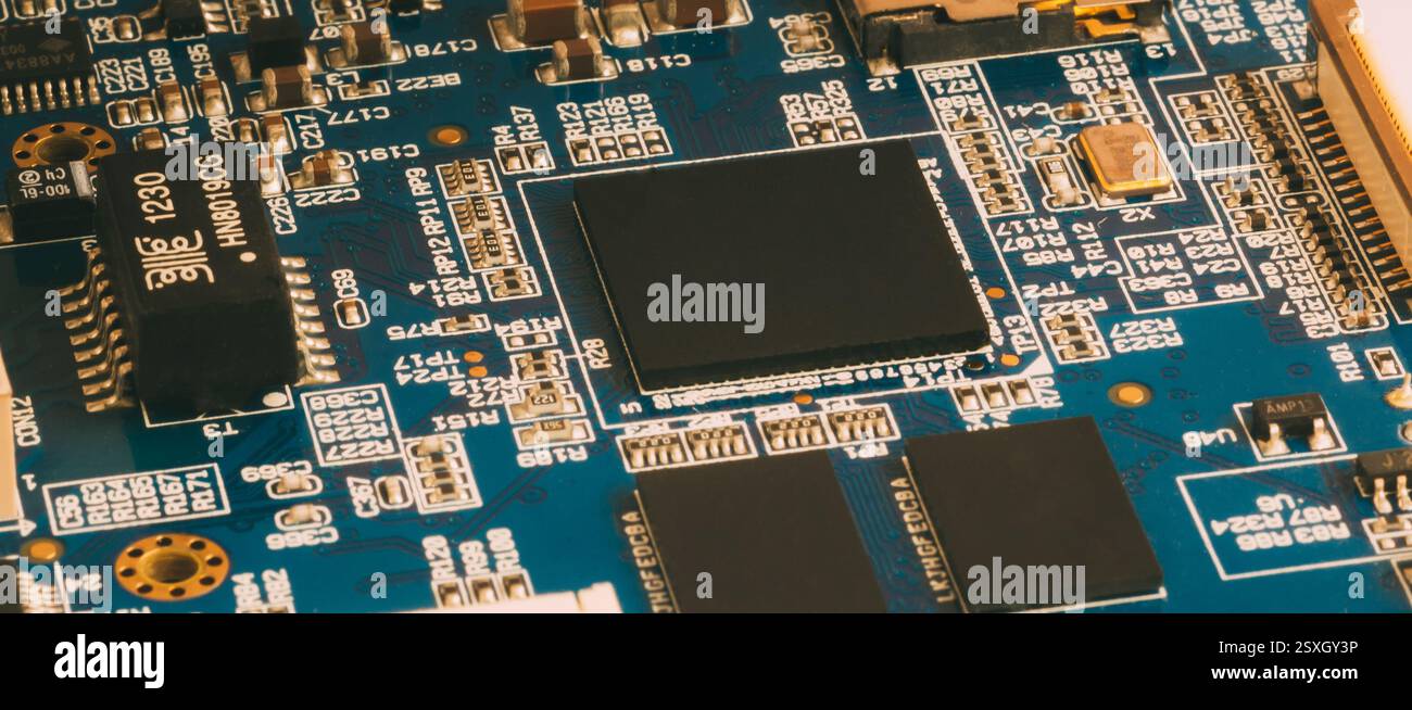 Electronic components, chips and capacitors on the blue pcb, close up ...
