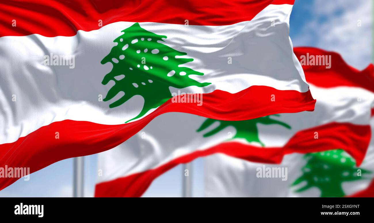 Lebanon national flags waving in the wind on a clear day. Three ...
