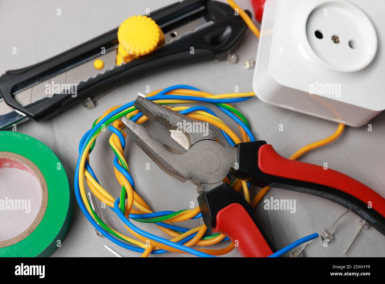 Different electrical tools on grey table, above view Stock Photo - Alamy