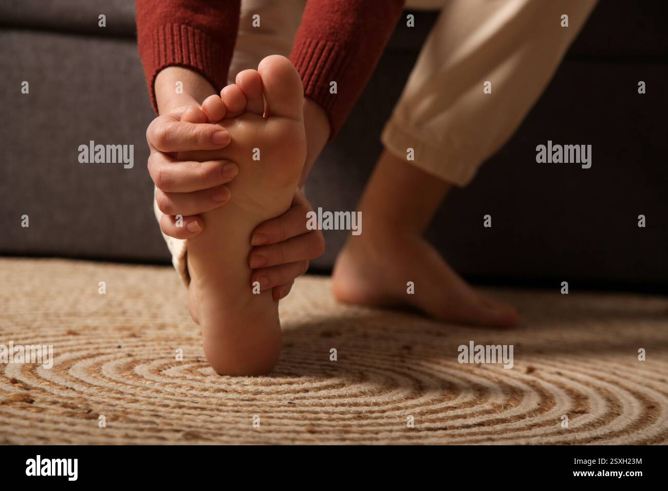 Bottom-of-the-foot pain. Woman dealing with chronic sore aching feet ...