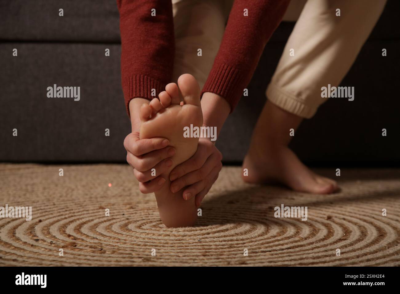 Bottom-of-the-foot pain. Woman dealing with chronic sore aching feet ...