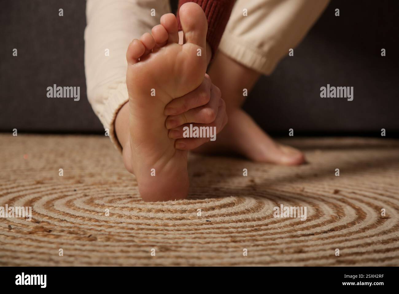 Bottom-of-the-foot pain. Woman dealing with chronic sore aching feet ...