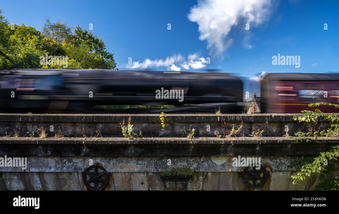 Steam passing the bridge Stock Photo - Alamy