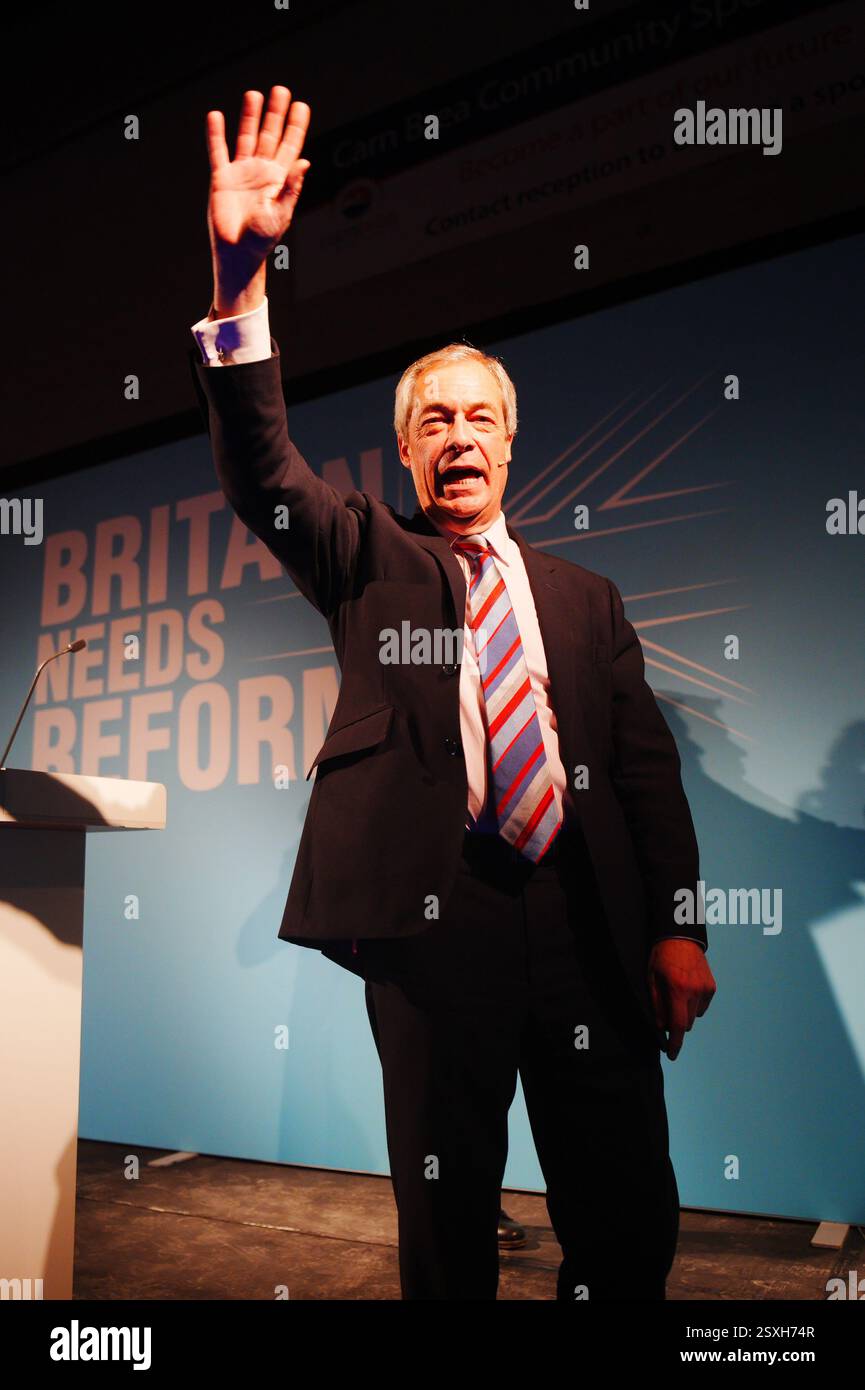Reform UK leader Nigel Farage waves after speaking during the Reform UK ...