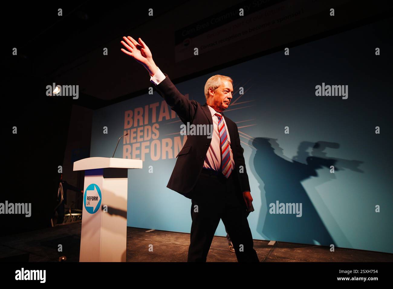 Reform UK leader Nigel Farage waves after speaking during the Reform UK ...