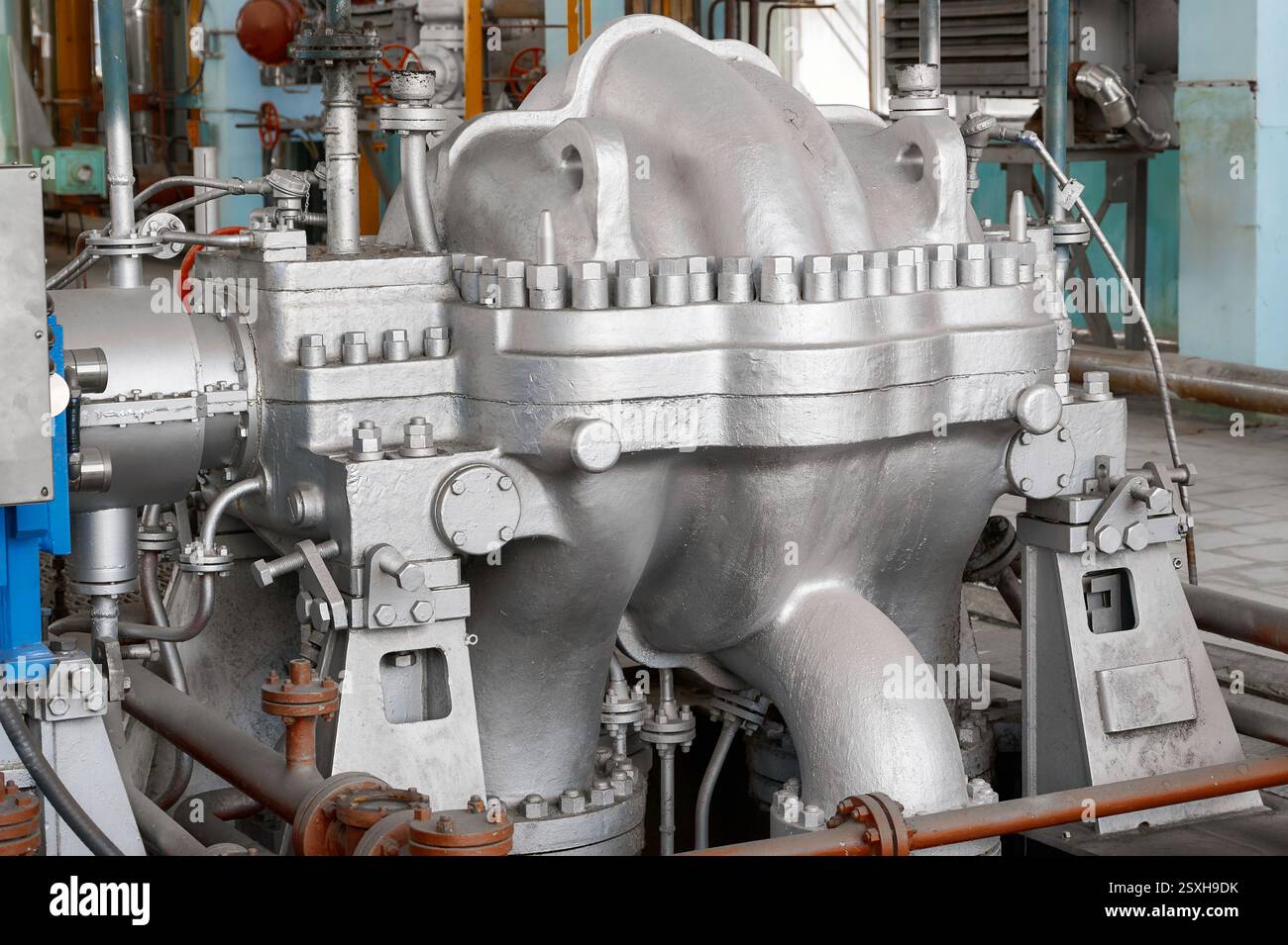 A powerful industrial pump operating in a chemical plant showcasing ...