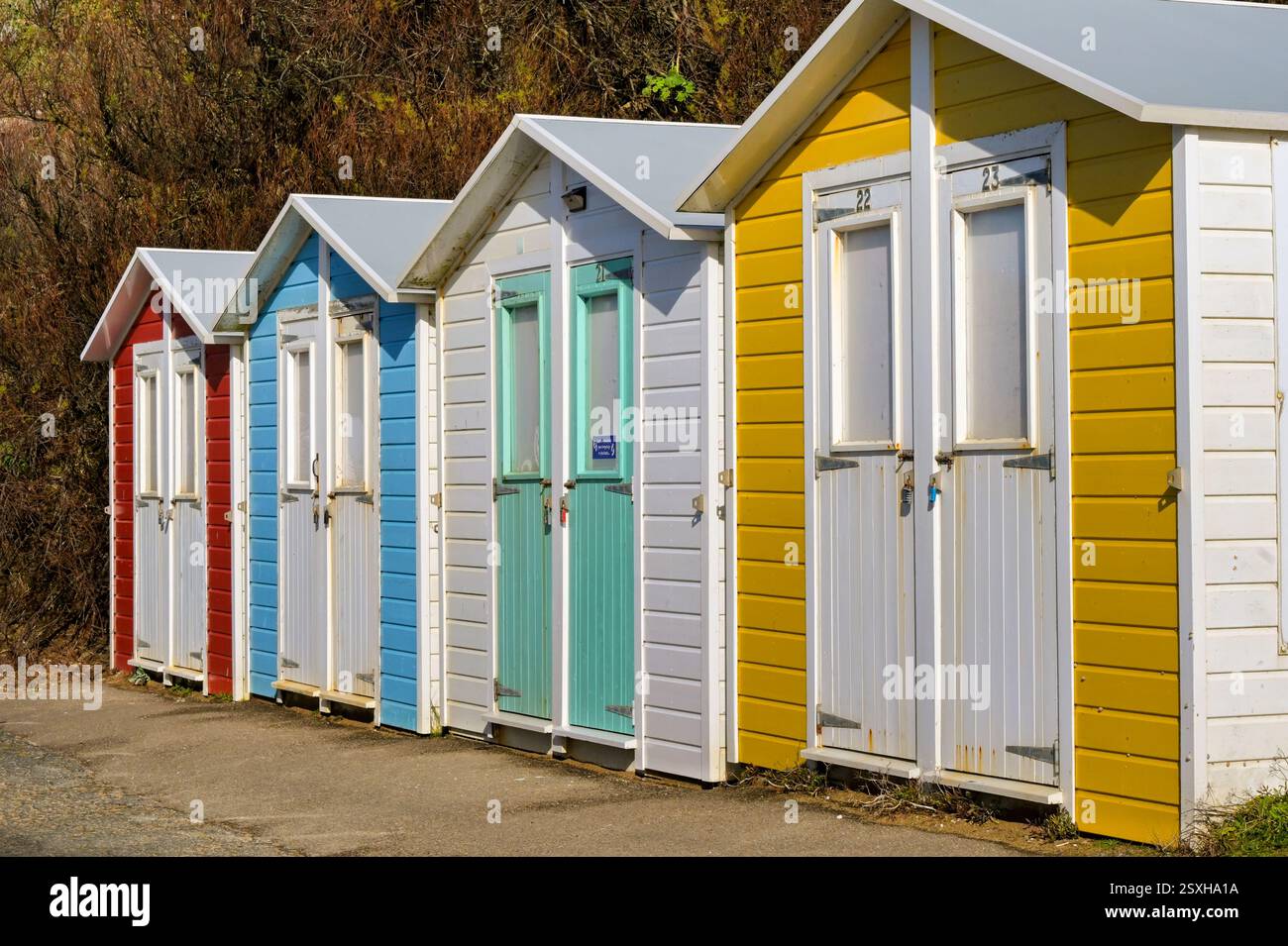 Bude, Cornwall, UK - 22 February 2025: Row of beach huts painted in ...