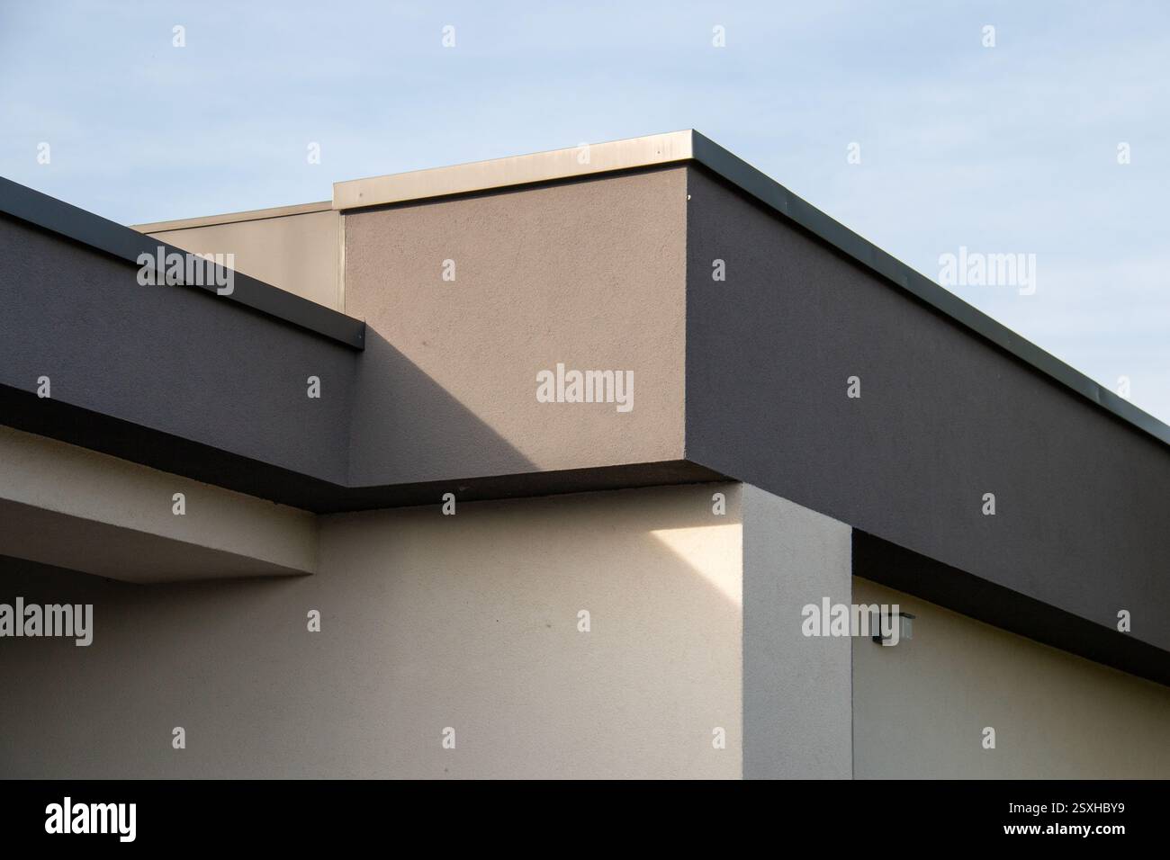 Minimalist building corner with clean lines and subtle shadows. A ...