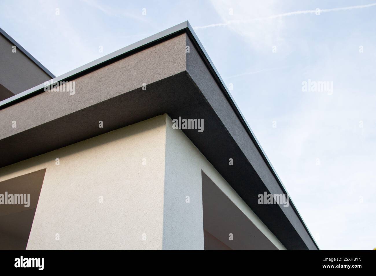 An elegant structure showcases a blend of materials with a striking ...