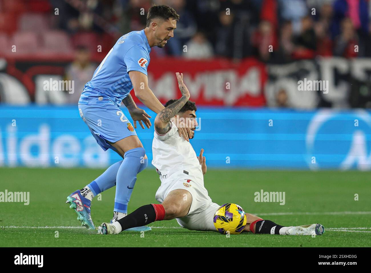 Isaac Romero of Sevilla FC and Antonio Raillo of RCD Mallorca Credit ...
