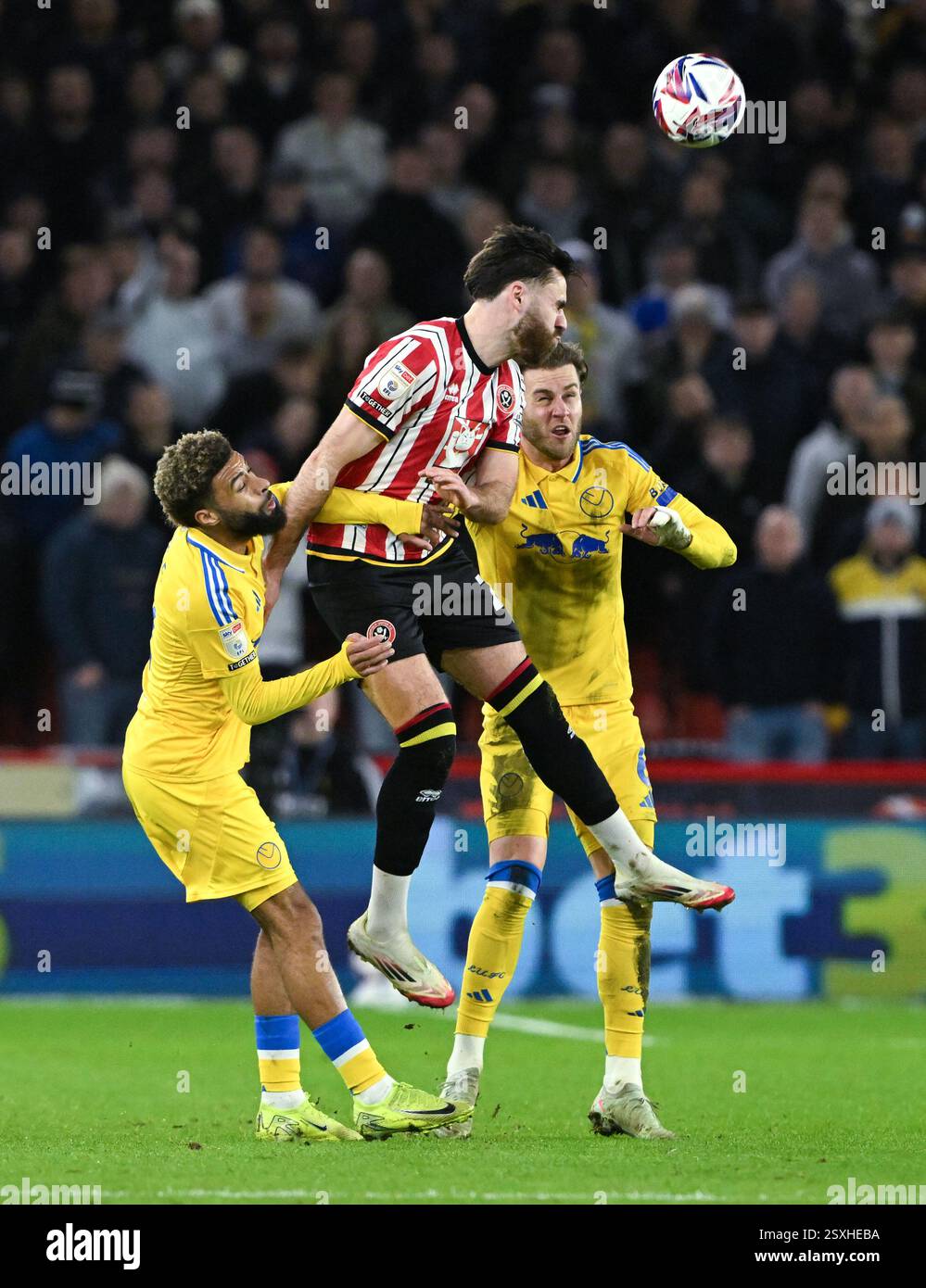 Leeds United's Jayden Bogle (left), Sheffield United's Ben Brereton ...