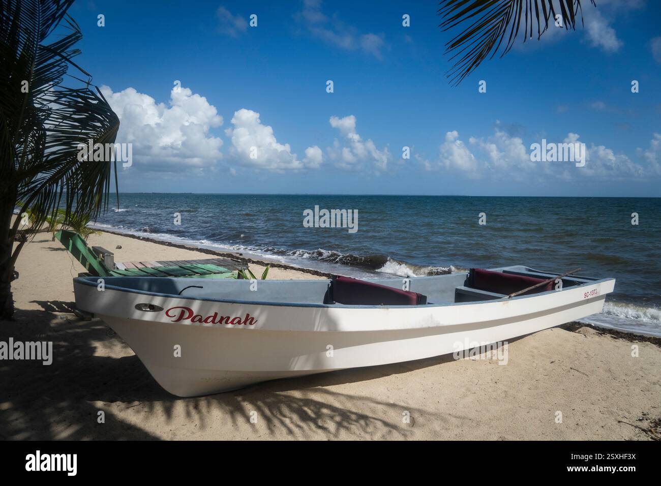 Boat on the beach in Hopkins, Belize Stock Photo - Alamy