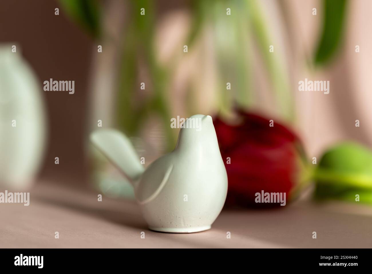 abstract image: white bird figurine on a soft background. symbol of ...