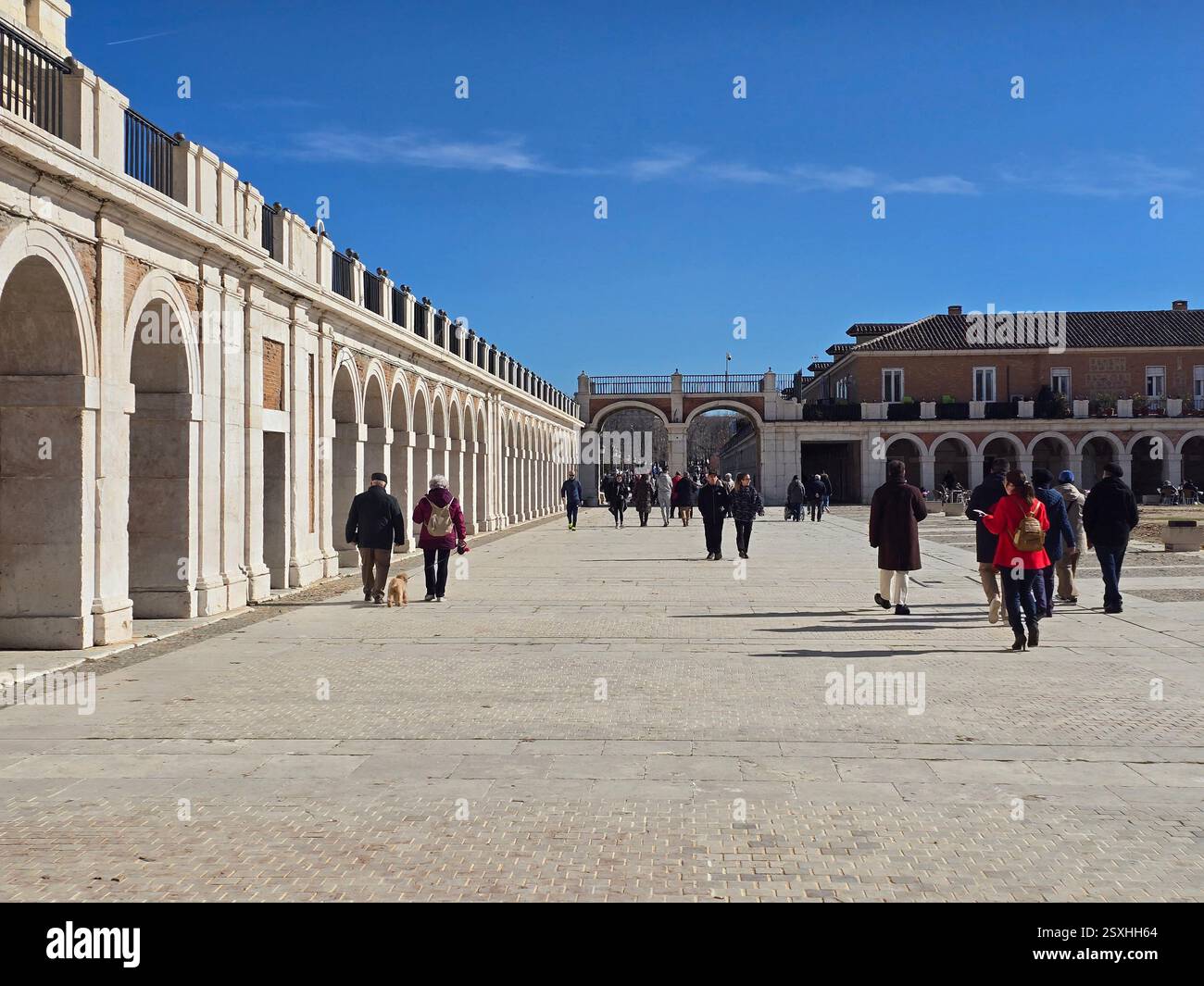 Blue sky with a big square and various people walking hi-res stock ...
