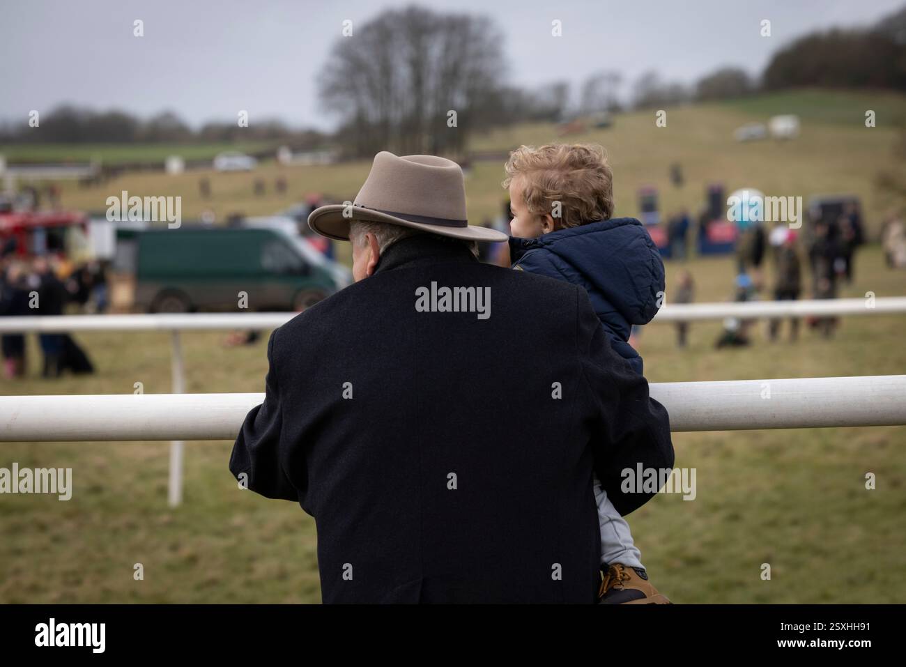A local farmer holds his grandchild whilst attending a Point-to ...