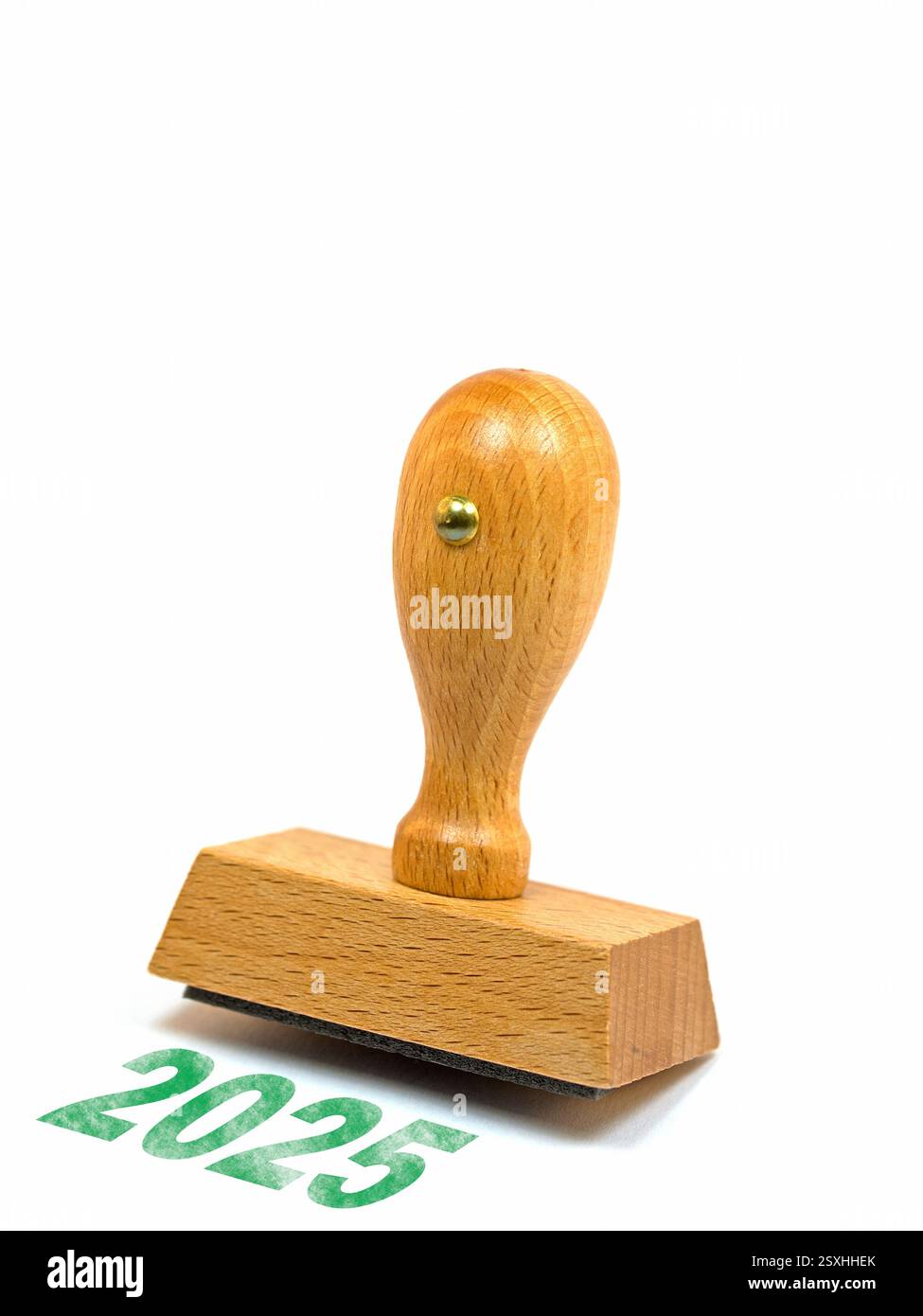 Wooden stamp with the imprint 2025 against a white background Stock ...