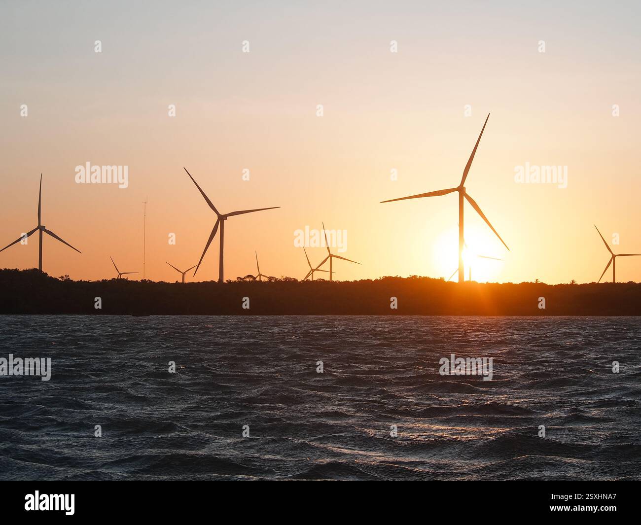 Onshore wind turbines at the coast of Brazil showing sustainability ...