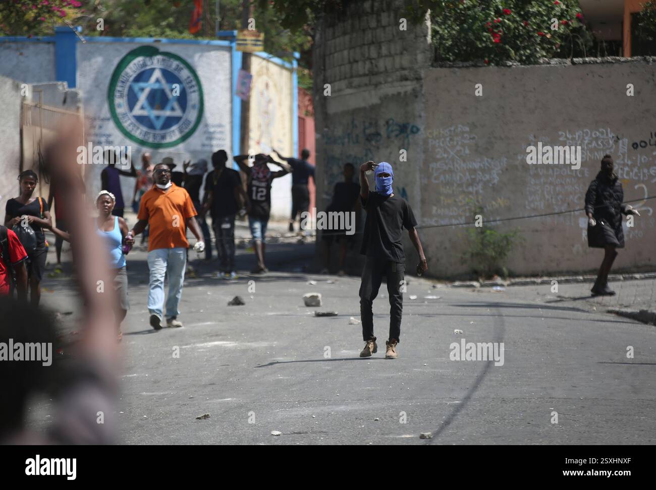Residents from the Solino neighborhood block a street to demand ...