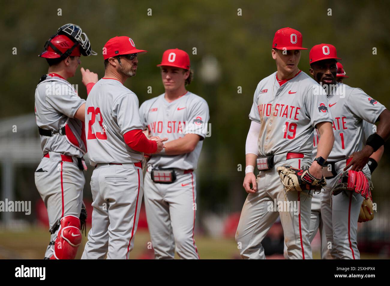 Ohio State Buckeyes pitching coach Tyler Robinson (23) makes a pitching ...