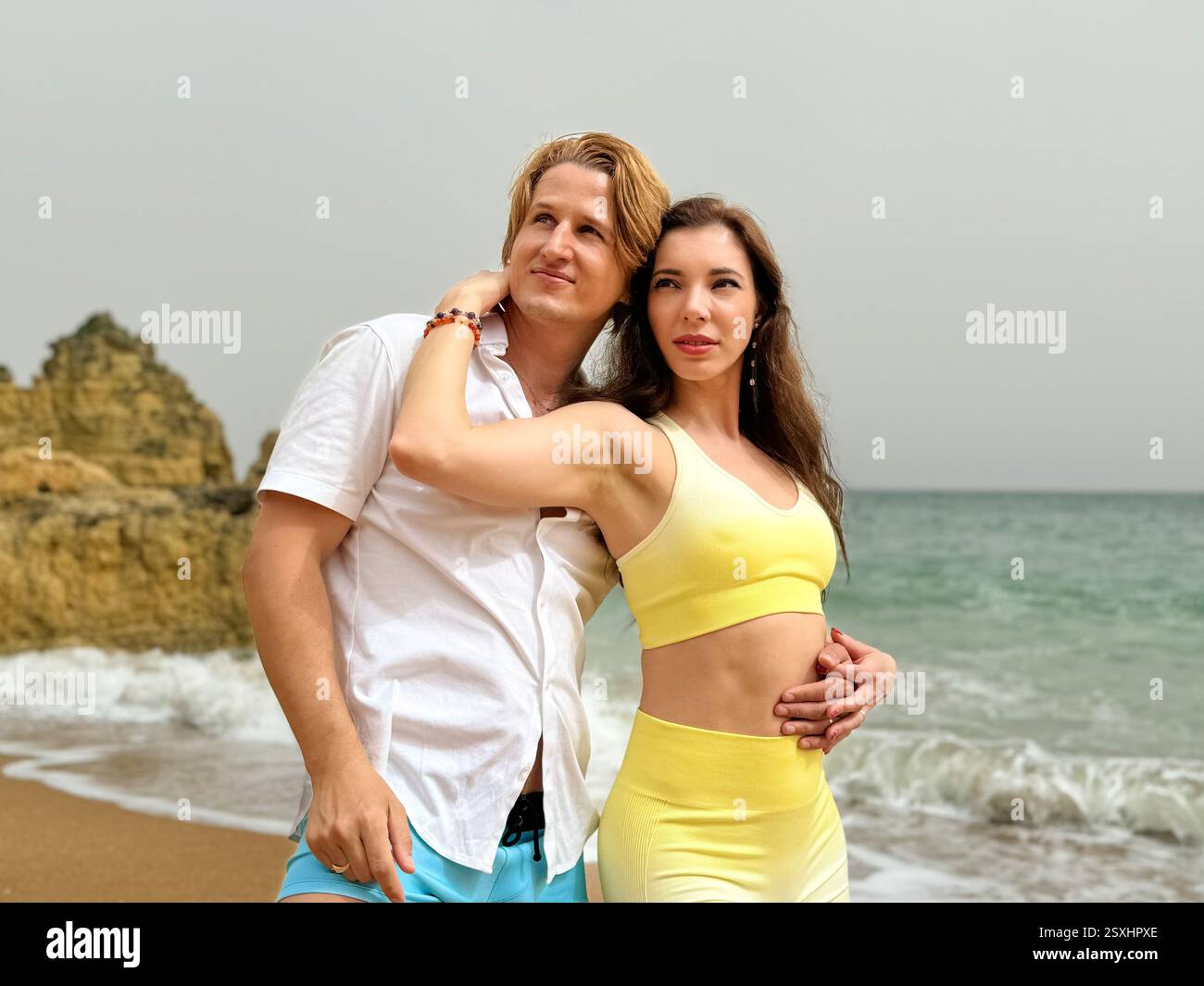 Stylish Couple posing in Embracement: Beachside Connection and ...
