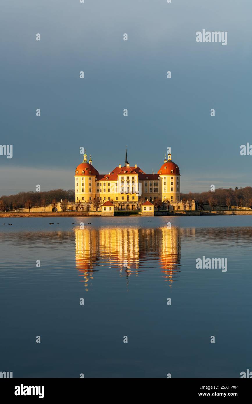 Moritzburg Castle reflected in calm waters lake, showing majestic ...