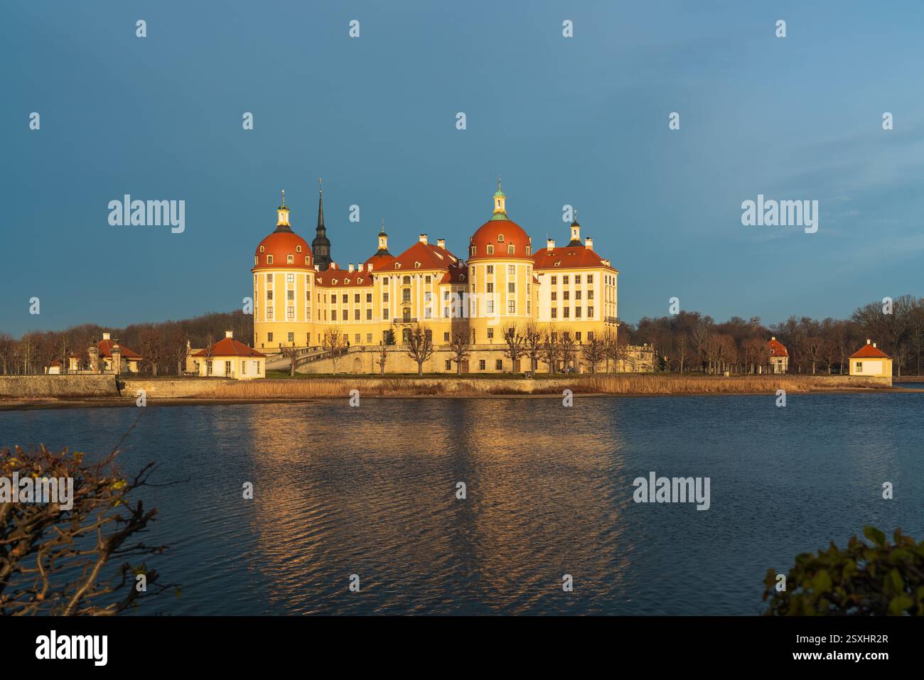 Moritzburg Castle reflected in calm waters lake, showing majestic ...