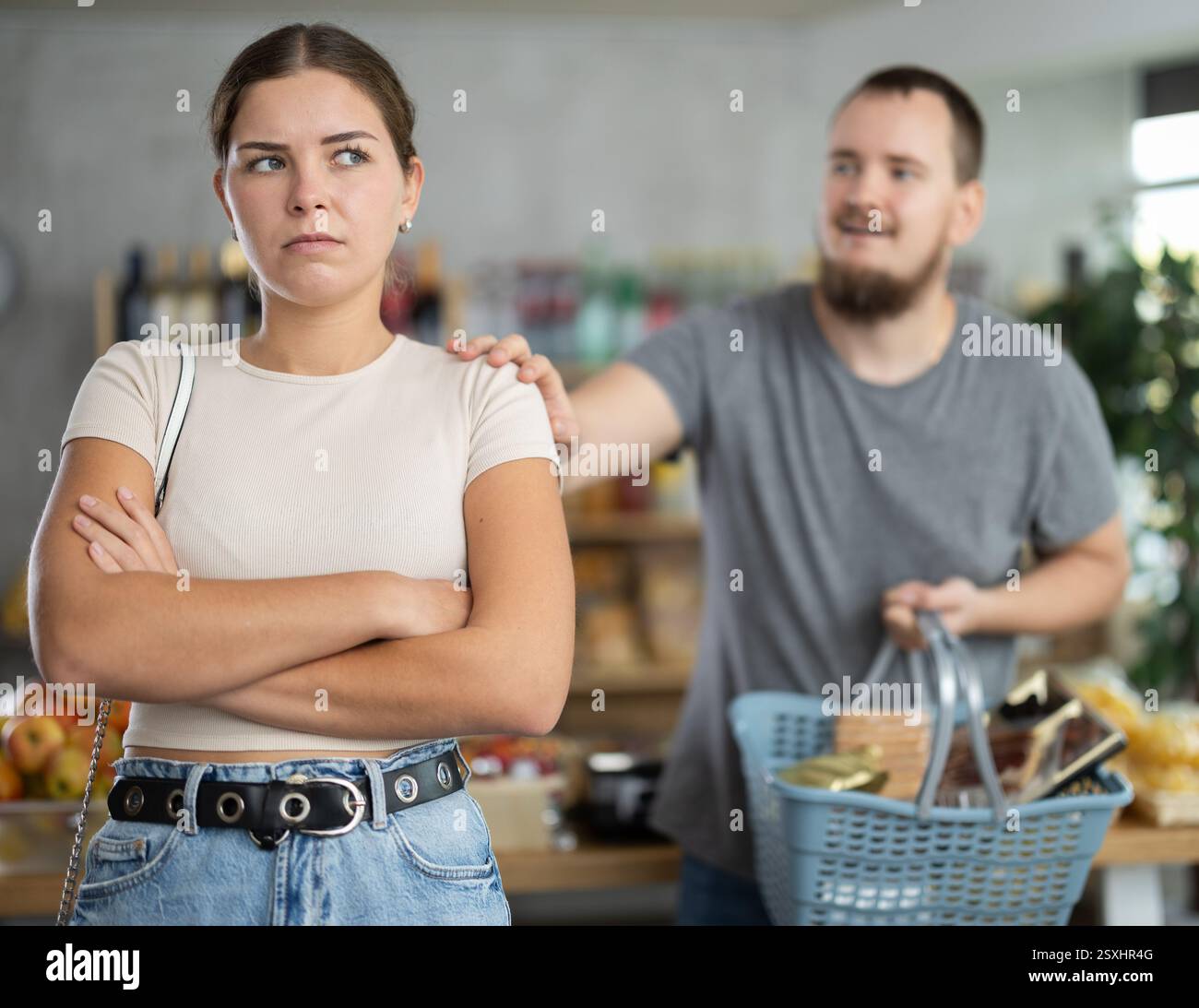 Angry girl turned away from husband during quarrel, he want to make ...