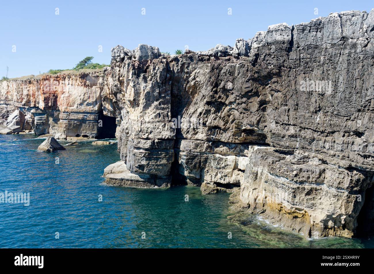 Dramatic cliffs rise above the Atlantic, rugged rock formations meet ...